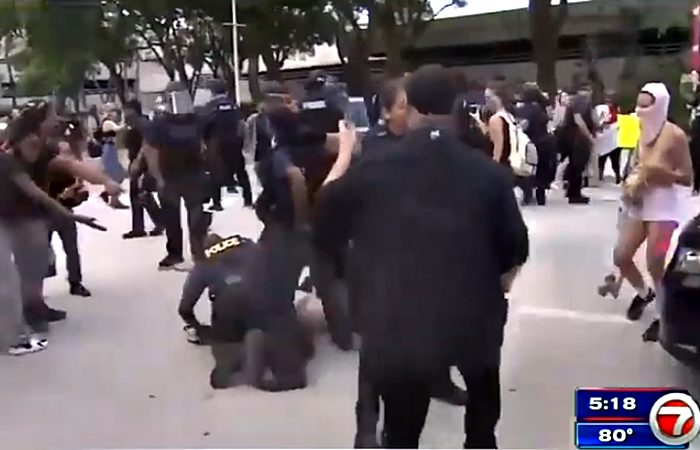 Muslim Protester Says Police Violated Her By Removing Her Hijab